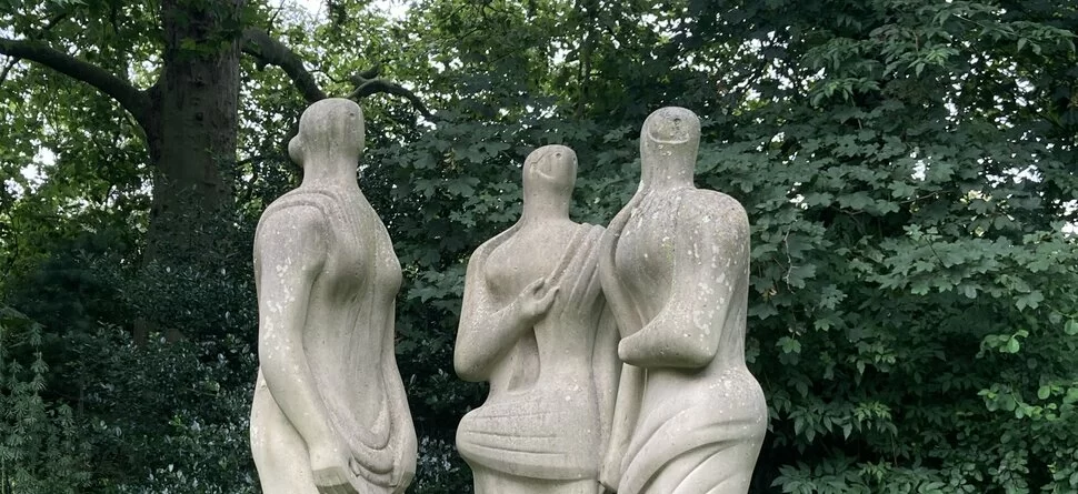 three standing figures